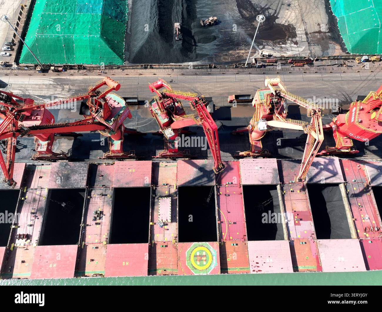 LIANYUNGANG, CHINA - JUNE 20, 2026 - A cargo ship was unloading ...