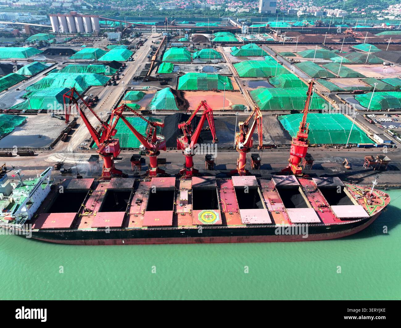 LIANYUNGANG, CHINA - JUNE 20, 2026 - A cargo ship was unloading ...
