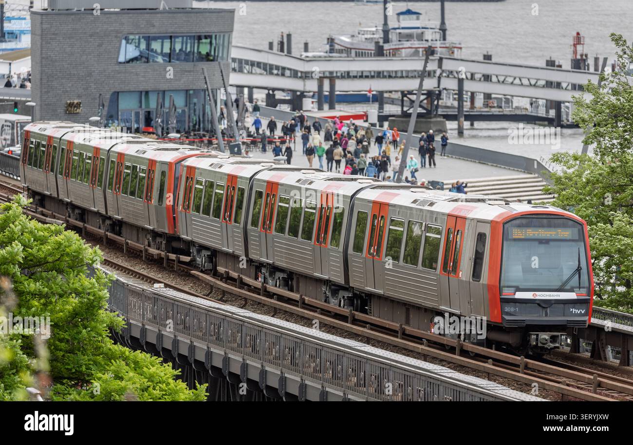 14 June 2026, Hamburg: A train on Subway Line 3 runs between the ...