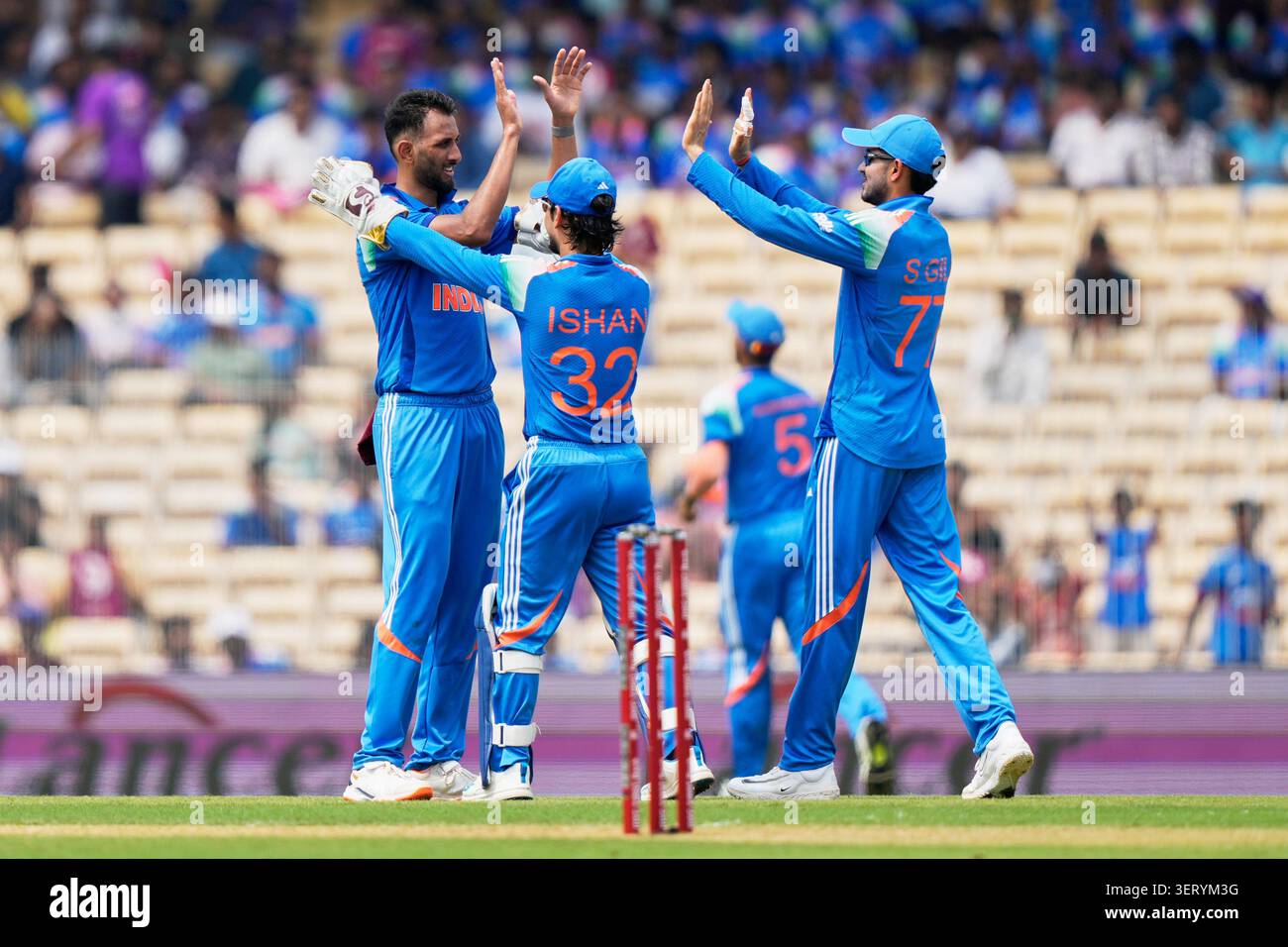 India's Prasidh Krishna, left, celebrates with teammates the wicket of ...