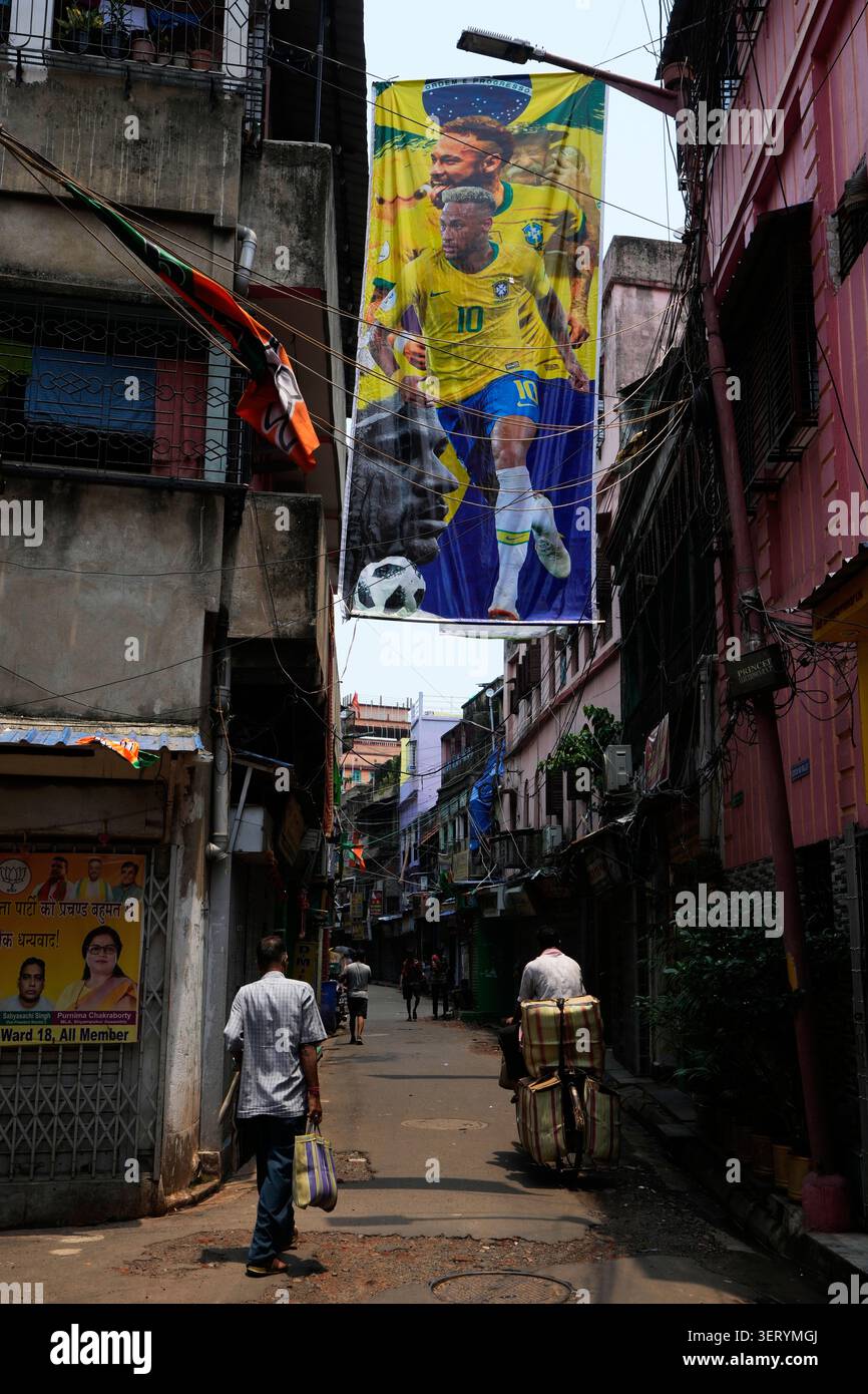 A huge flex poster of Brazil's Neymar hangs over a street between ...