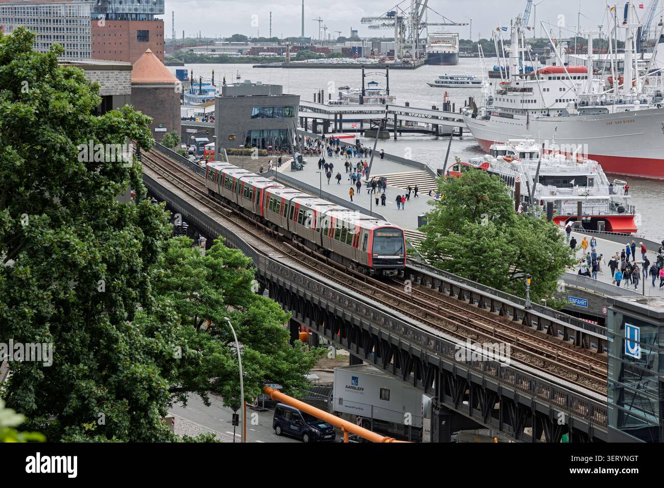 14 June 2026, Hamburg: A train on Subway Line 3 runs between the ...
