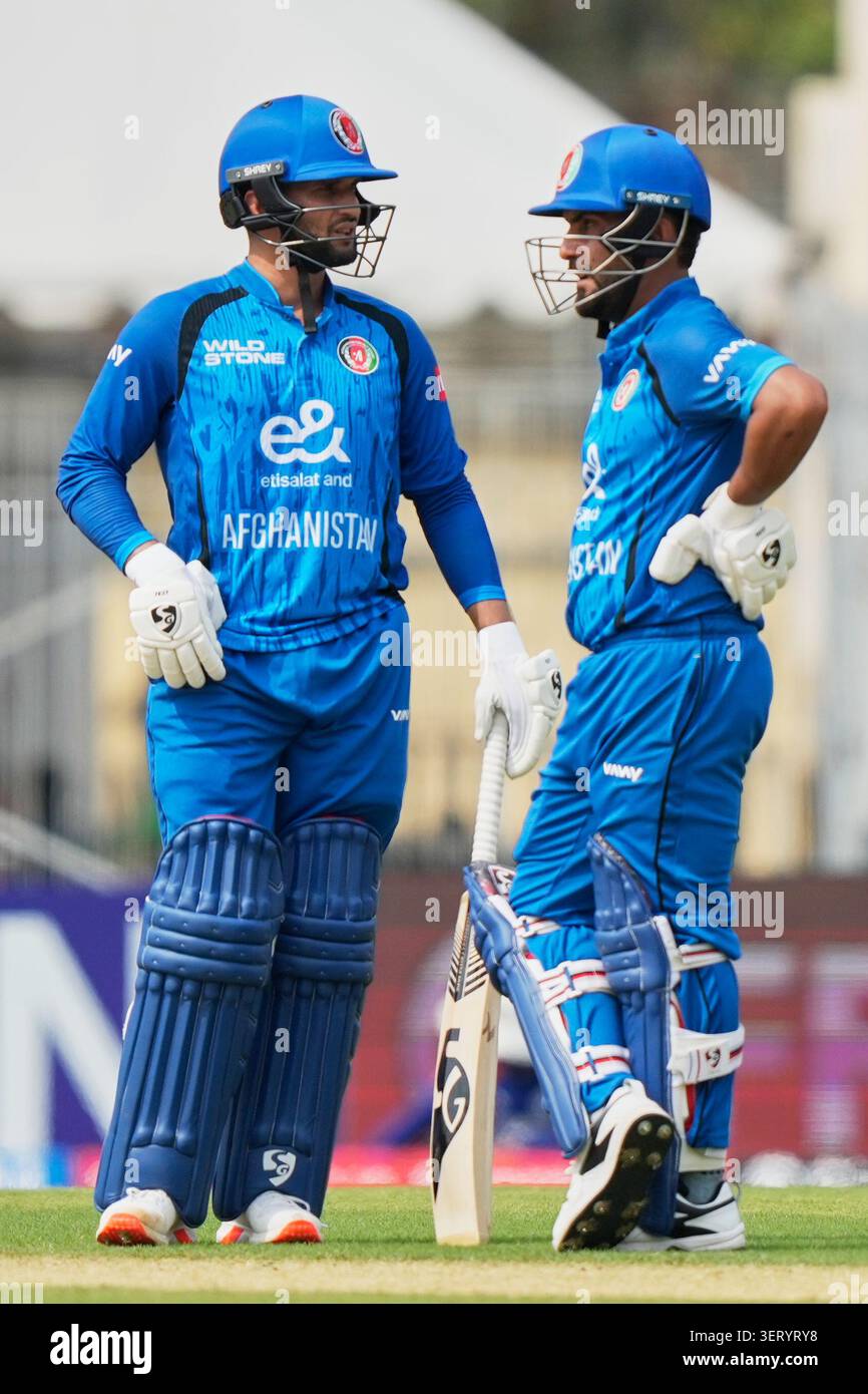Afghanistan's captain Hashmatullah Shahidi, right, and batting partner ...