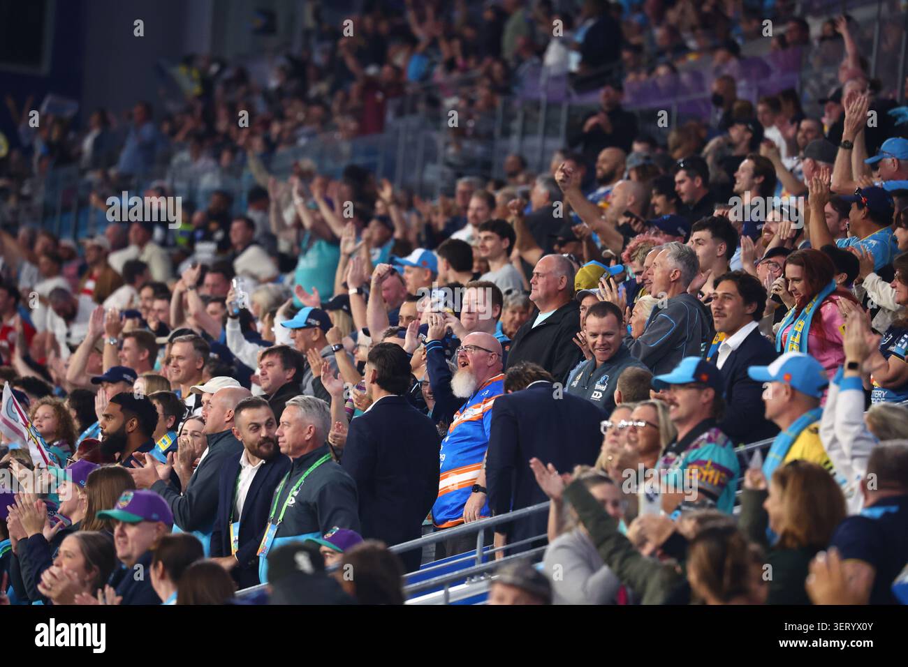 Titans fans celebrate during the NRL Round 16 match between the Gold ...