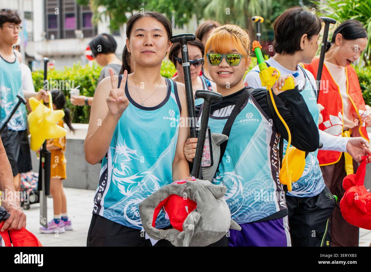 Two competitors celebrate after their heat at the Dragon Boat Race in ...