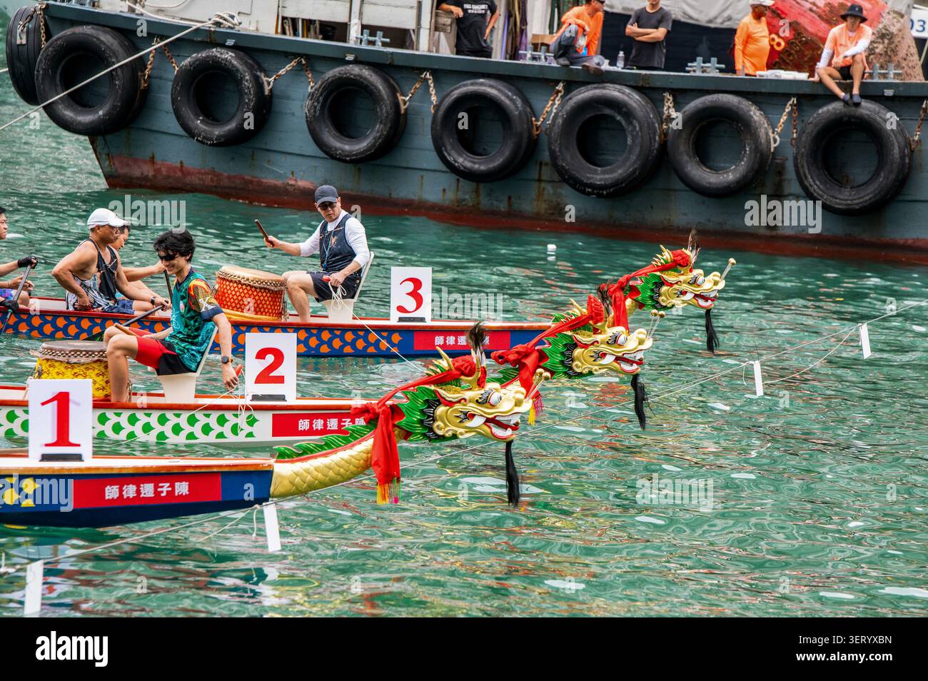 Rowers maneuver themselves to the starting line during the Dragon Boat ...