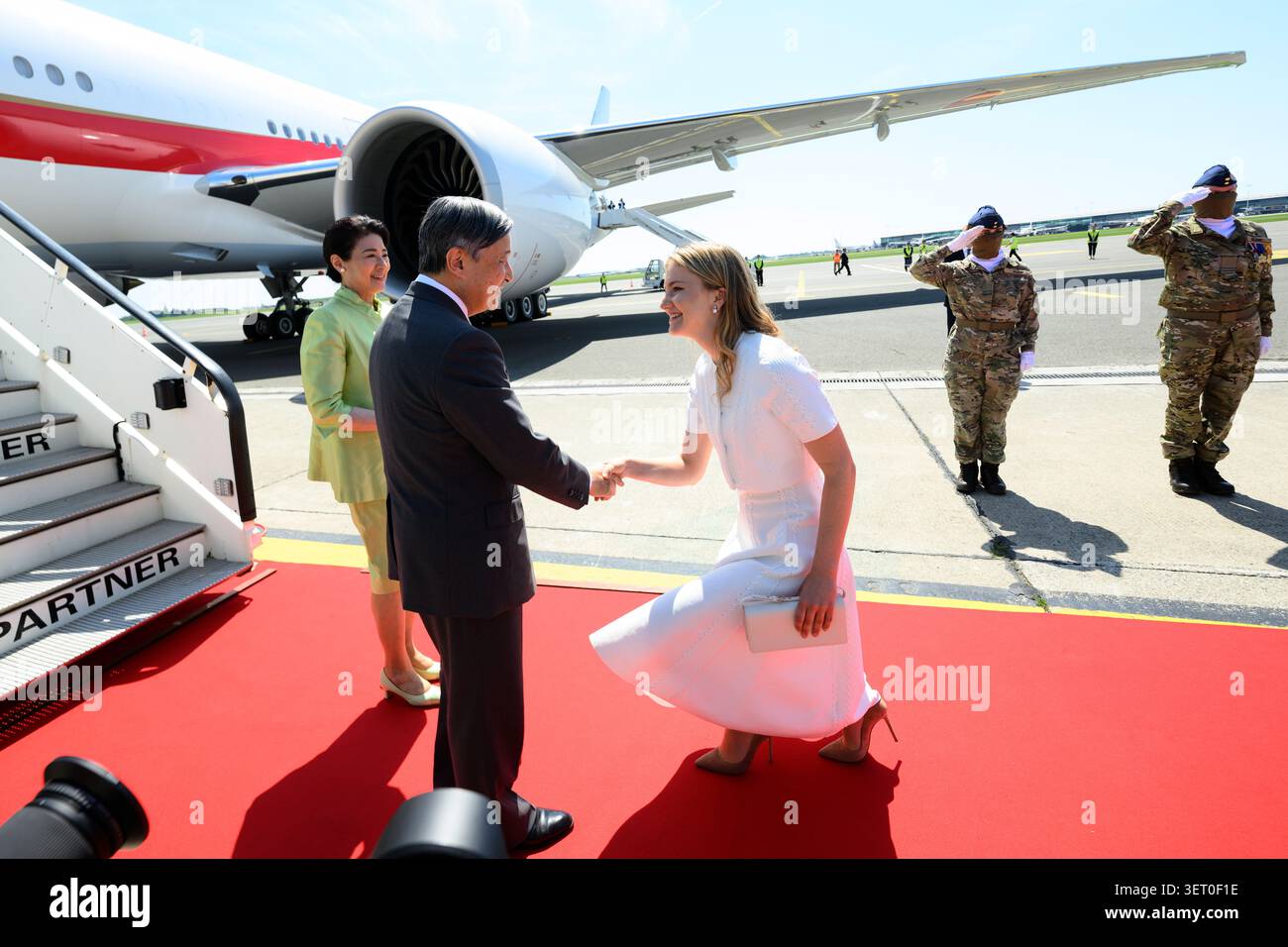 Belgium's Crown Princess Elisabeth, center, curtsies as she greets ...