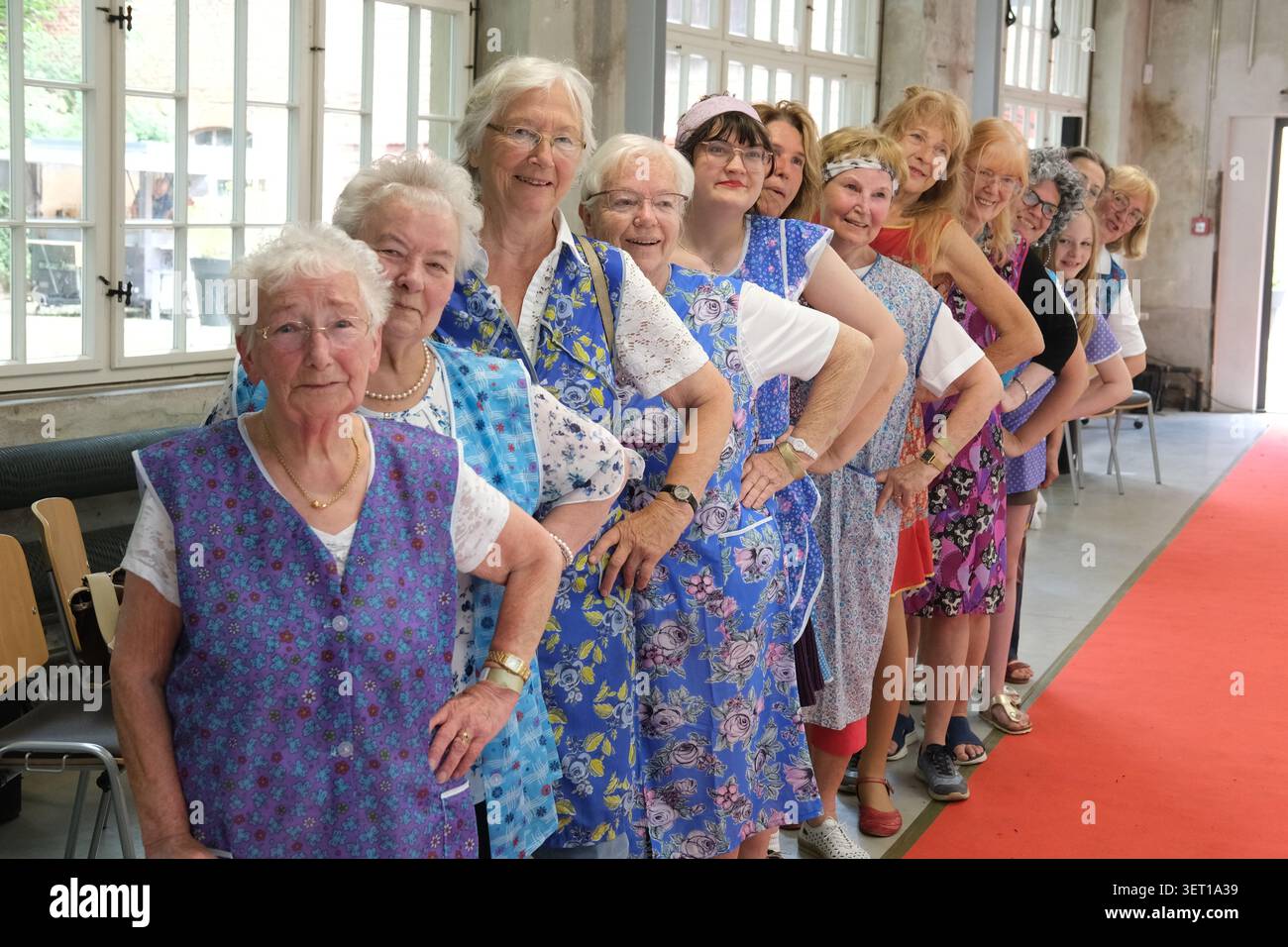 20 June 2026, Saxony, Crimmitschau: Visitors pose in lab coats at the ...