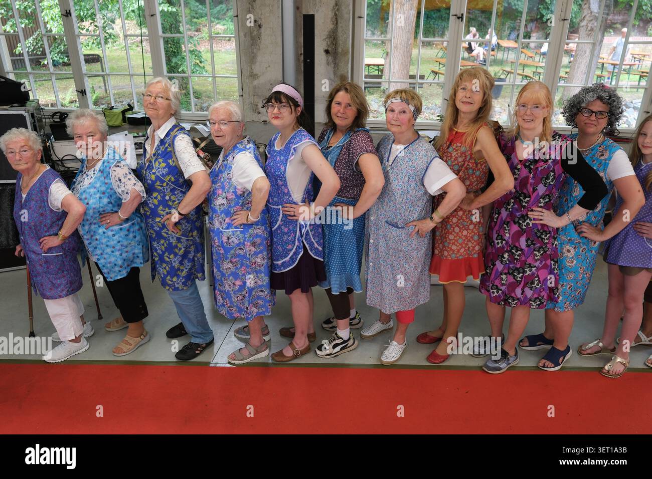 20 June 2026, Saxony, Crimmitschau: Visitors pose in lab coats at the ...
