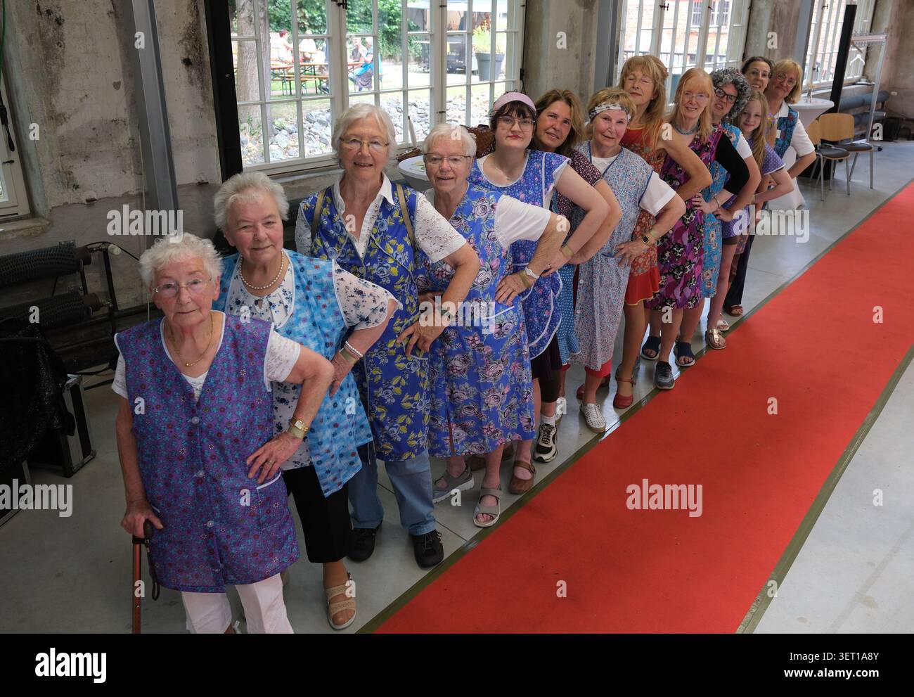 20 June 2026, Saxony, Crimmitschau: Visitors pose in lab coats at the ...