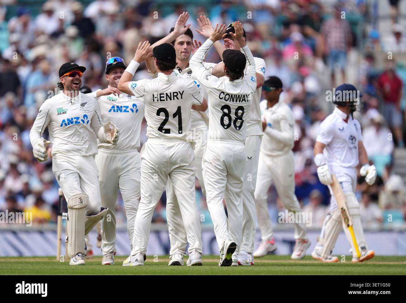 New Zealand's Will O'Rourke (centre, facing) celebrates with team-mates ...