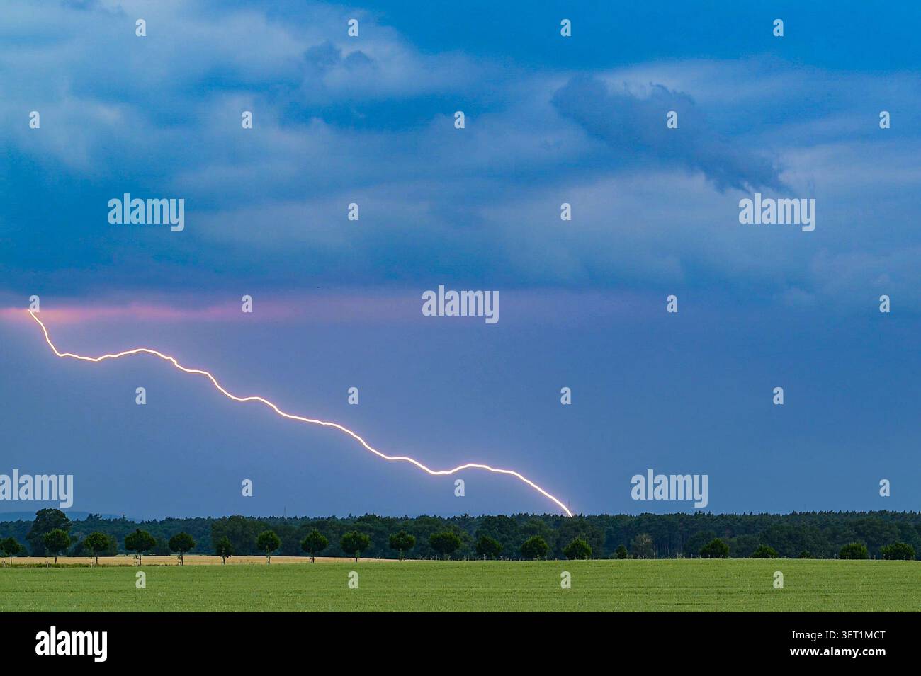 20 June 2026, Brandenburg, Petersdorf: A flash of lightning illuminates ...