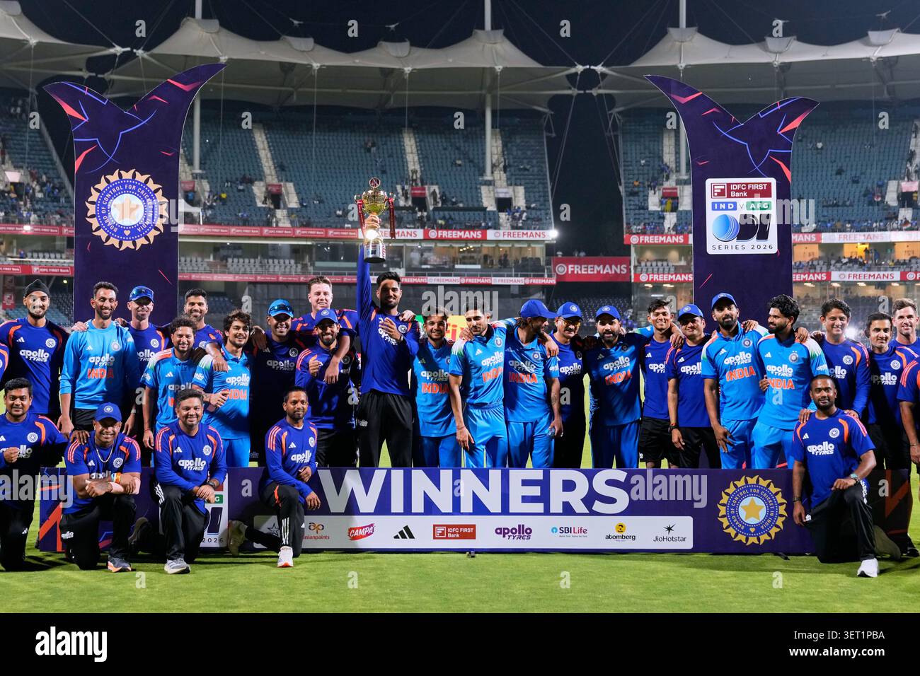 India's Gurnoor Brar carries the winners' trophy as he poses for a ...