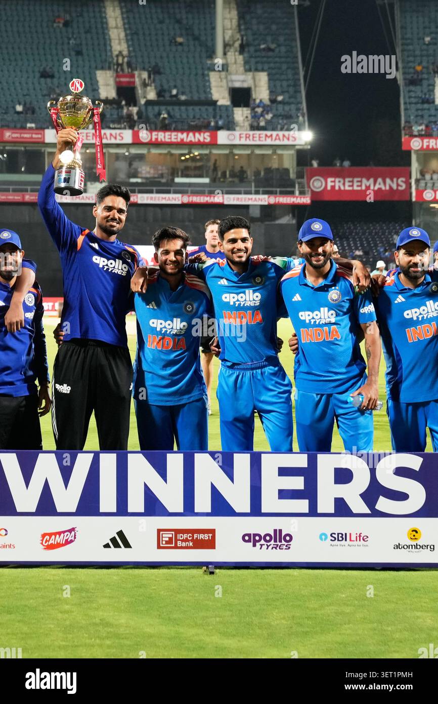 India's Gurnoor Brar carries the winners' trophy as he poses for a ...