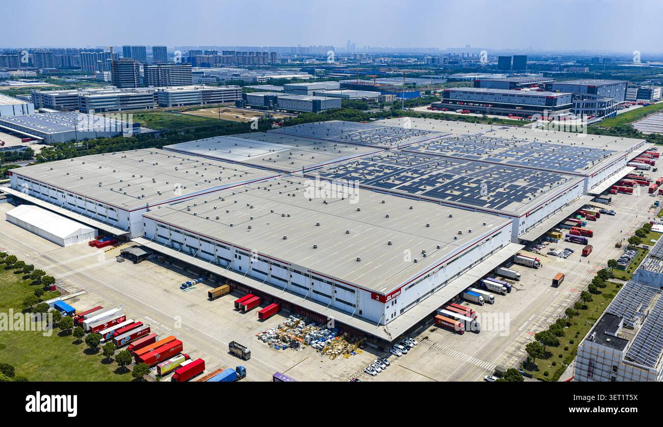Logistics vehicles deliver parcels at JD.com's Asia No.1 Suzhou Kunshan ...