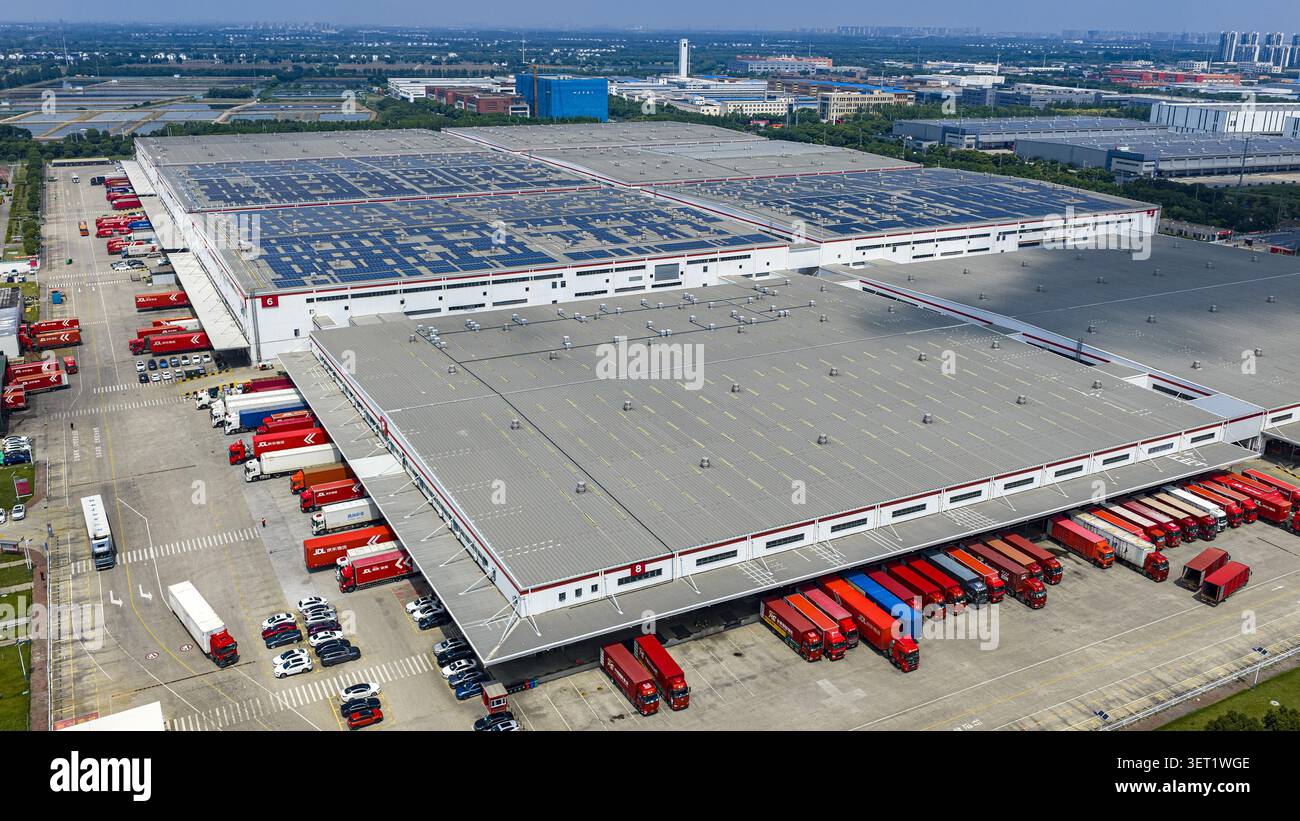 Logistics vehicles deliver parcels at JD.com's Asia No.1 Suzhou Kunshan ...