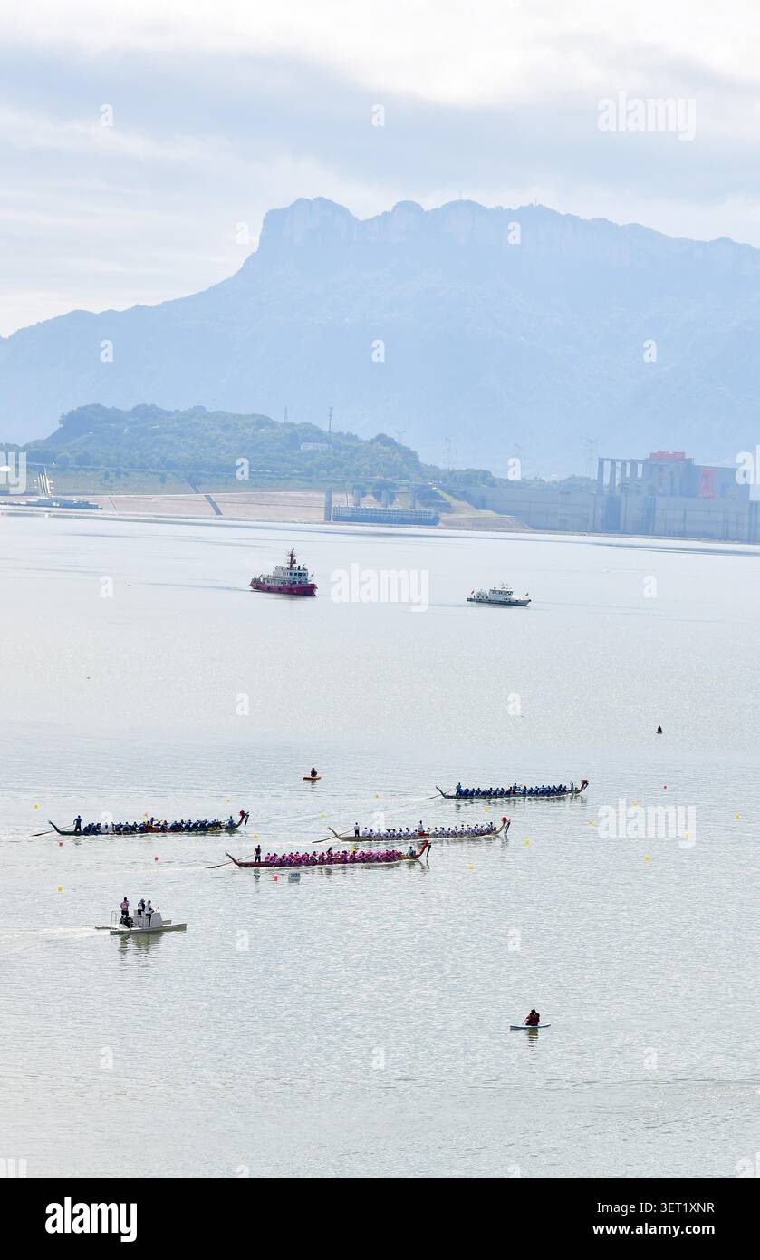 Dragon boat teams perform a soul-summoning ritual on the river during ...