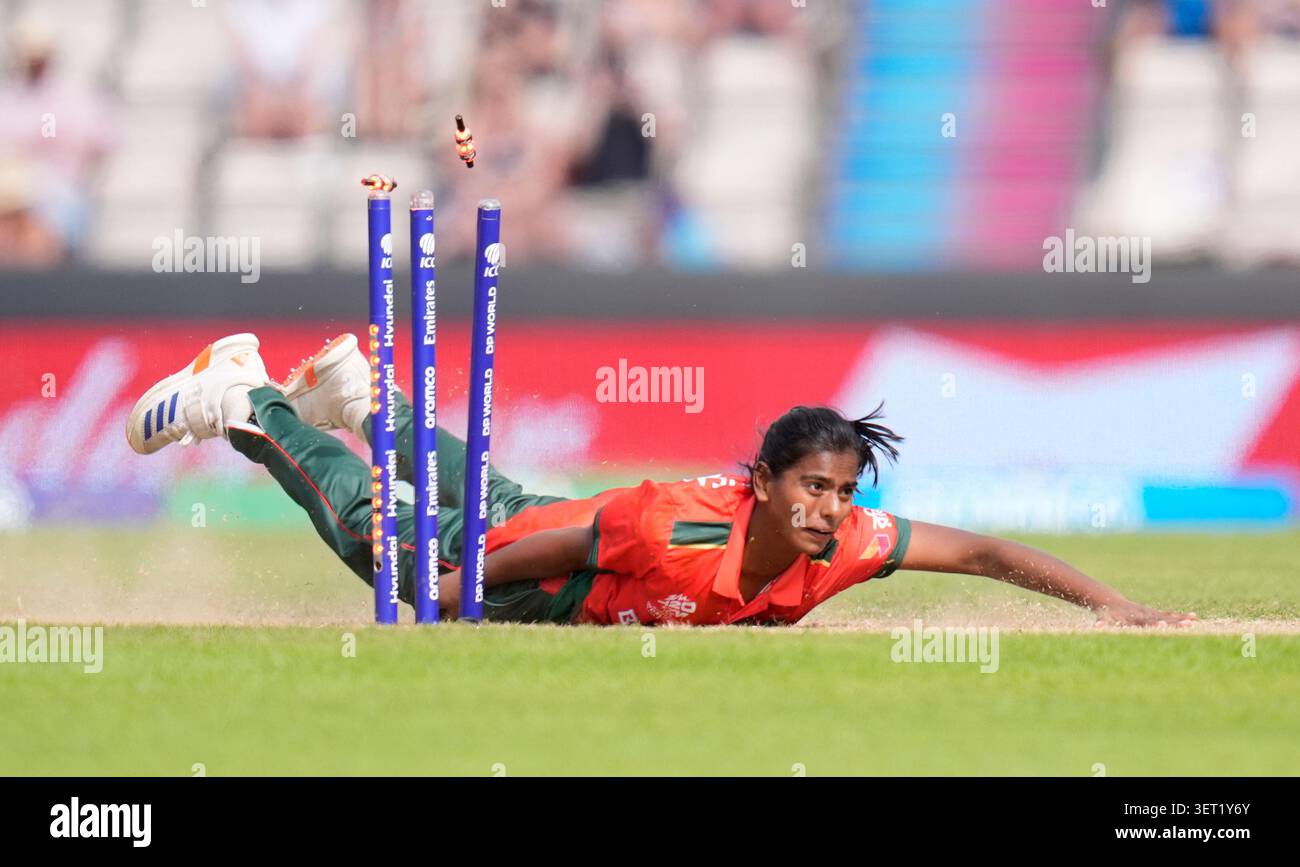 Marufa Akter of Bangladesh collides with the stumps after attempting to ...