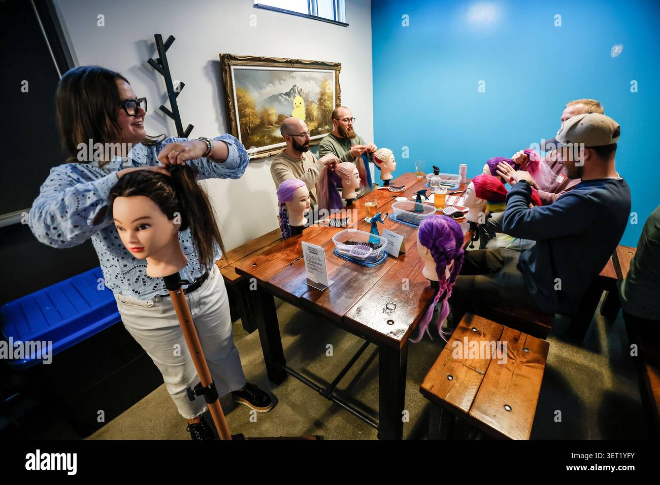 Ren Cherlet instructs fathers as they participate in "Beers and Braids ...