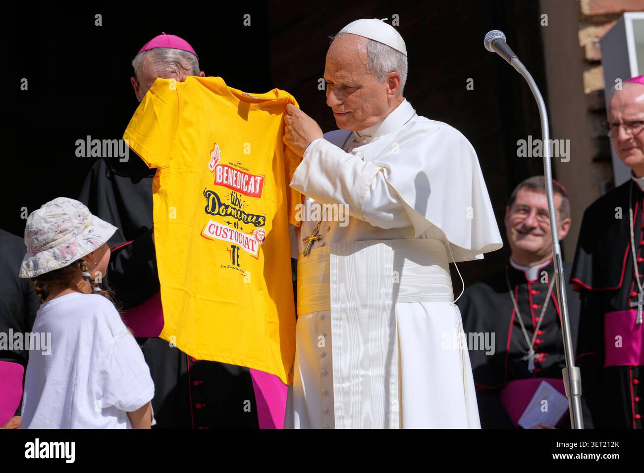 Pope Leo XIV is gifted with a t-sirt by children of the South American ...