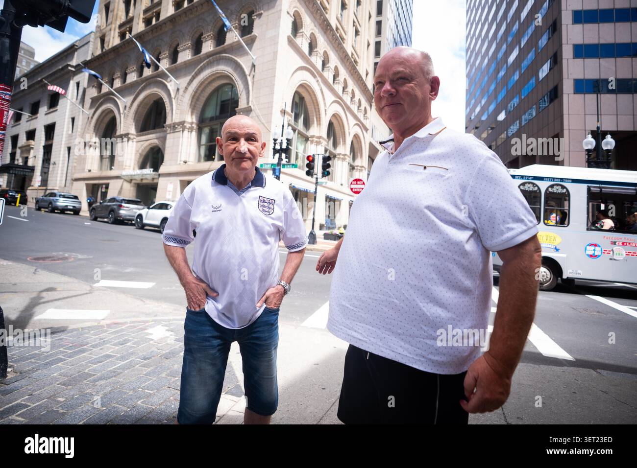 John Kiely, 62 and Tim Watters, 62 pose for a photo in downtown Boston ...
