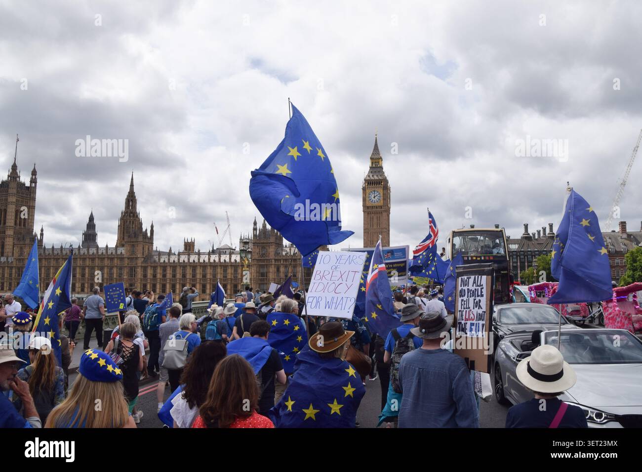 London, UK, 20th June 2026. Protesters pass across Westminster Bridge ...