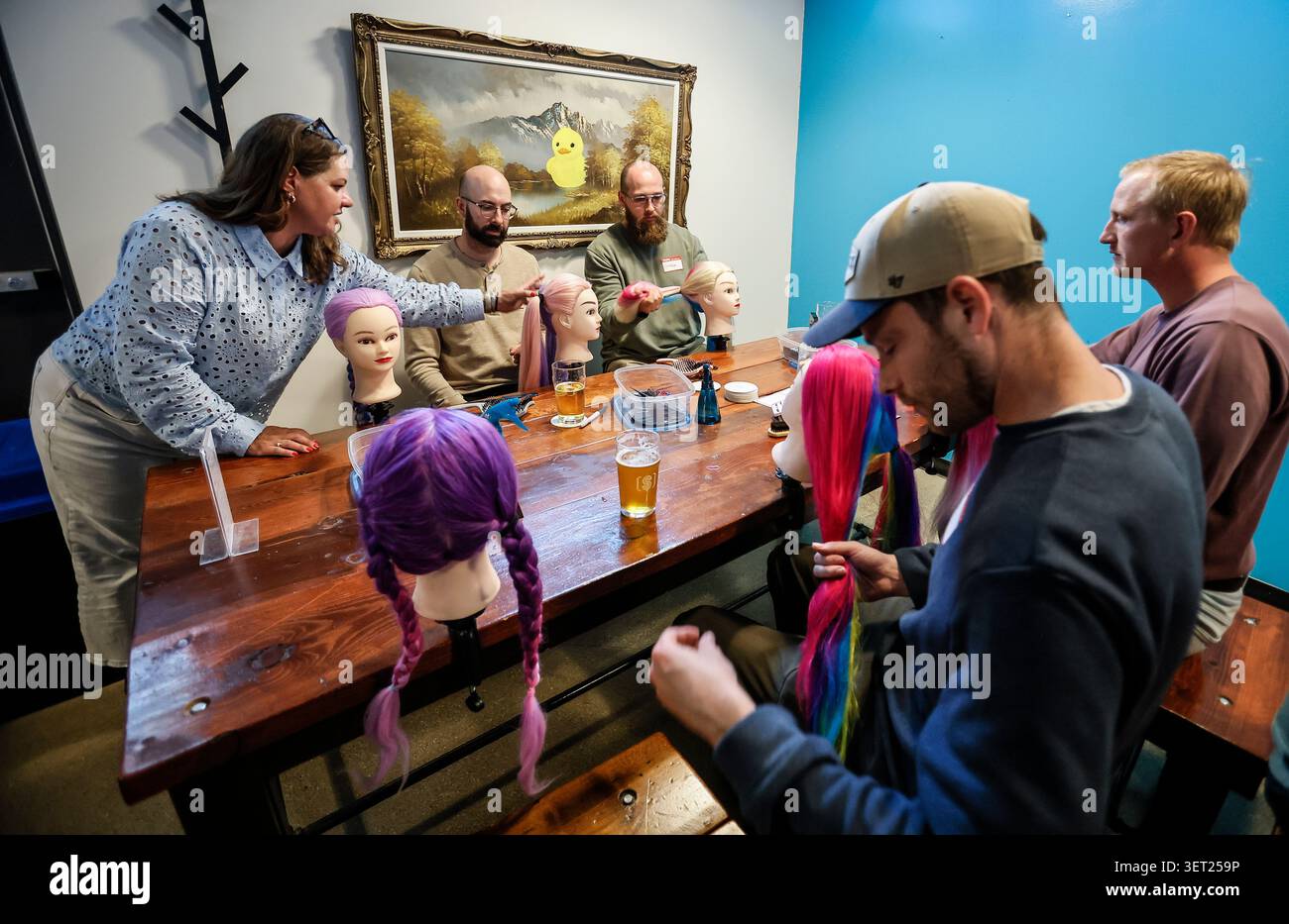 Ren Cherlet gives pointers to Steph, left, Graham and other fathers as ...