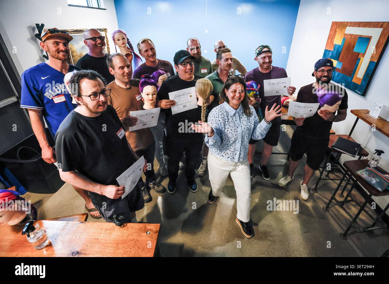 Ren Cherlet and a group of fathers pose for a photo after participating ...