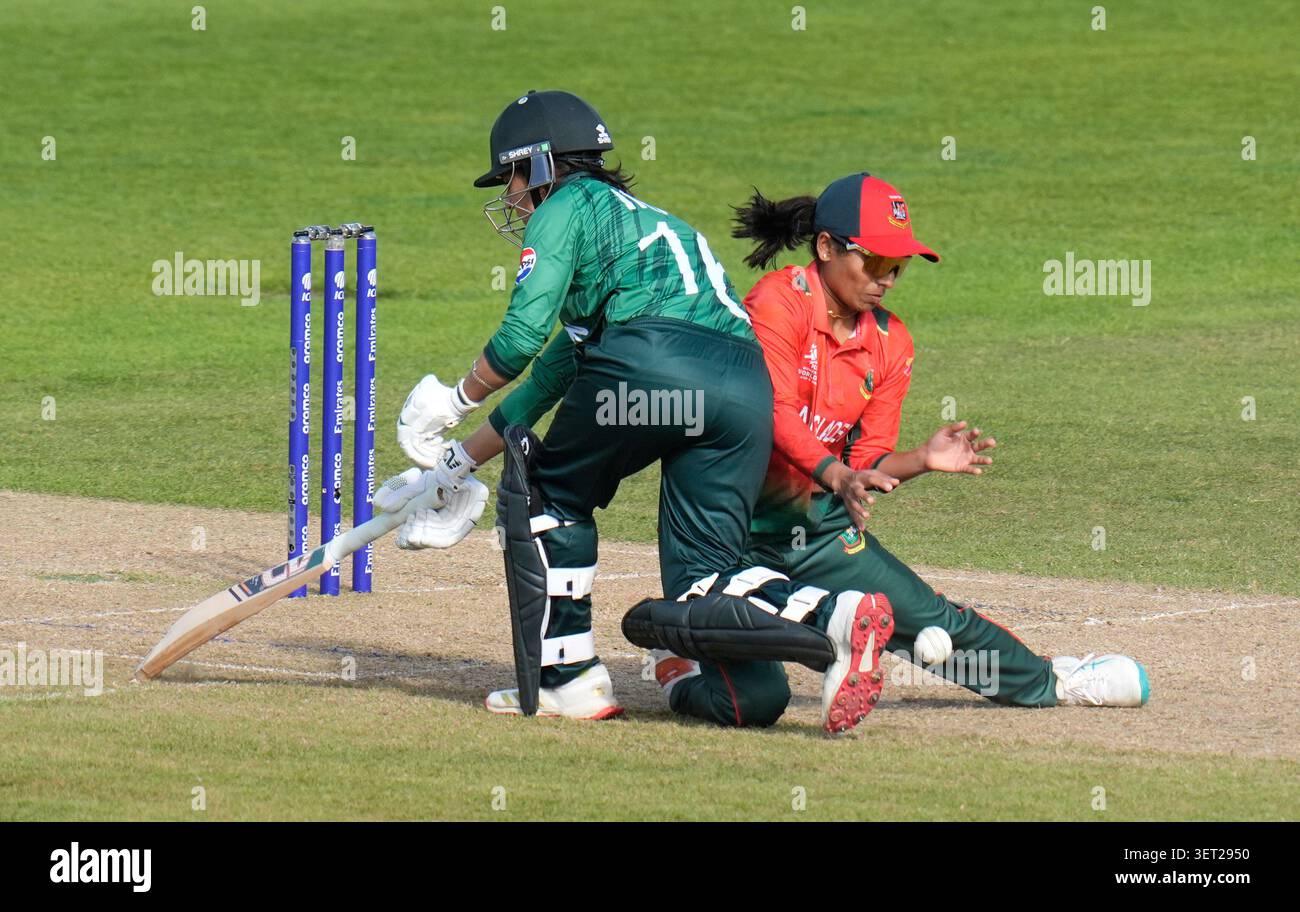 Rabeya Khan of Bangladesh (right) collides with Iram Javed of Pakistan ...