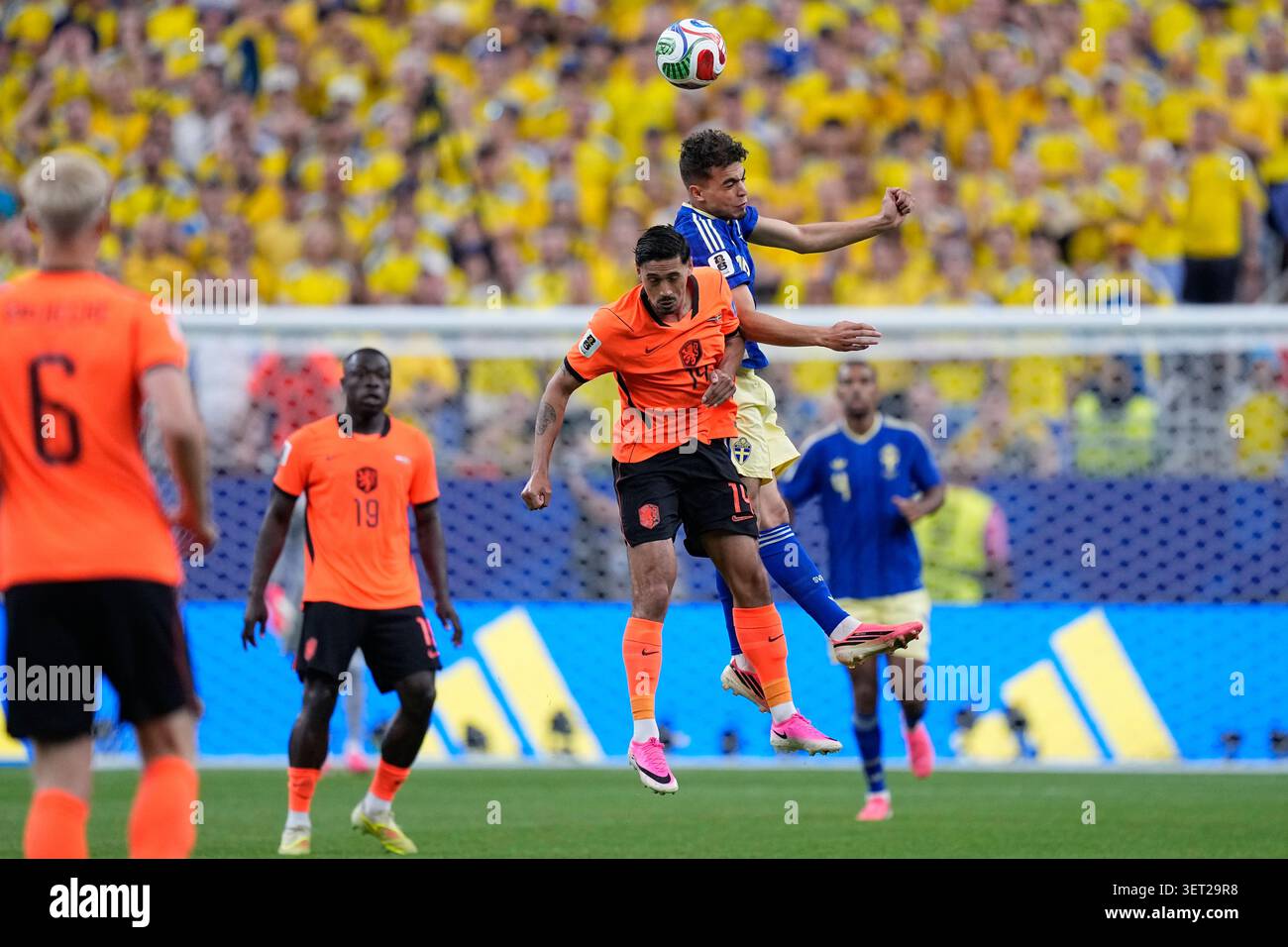 Netherlands' Tijjani Reijnders jumps for the ball with Sweden's Yasin ...
