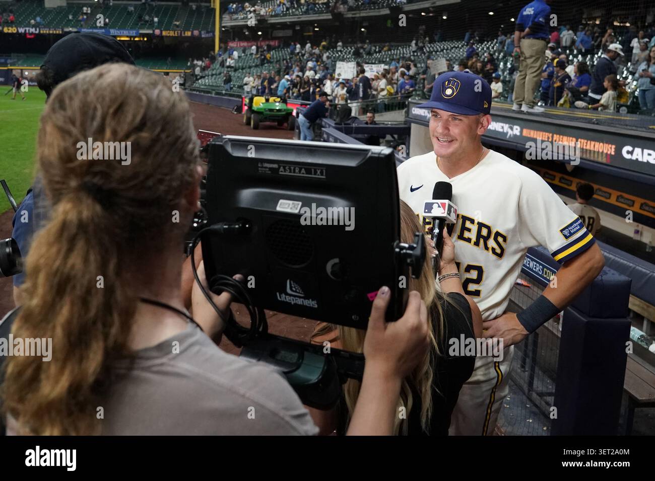 Milwaukee Brewers' Cooper Pratt gets interviewed after a baseball game ...