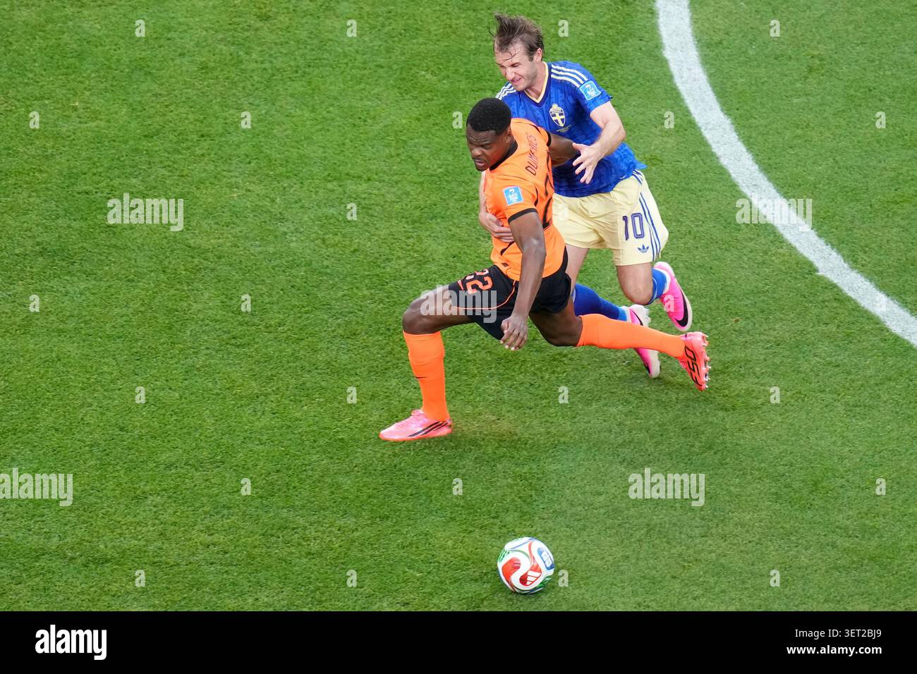 Netherlands' Denzel Dumfries, left, and Sweden's Benjamin Nygren battle ...