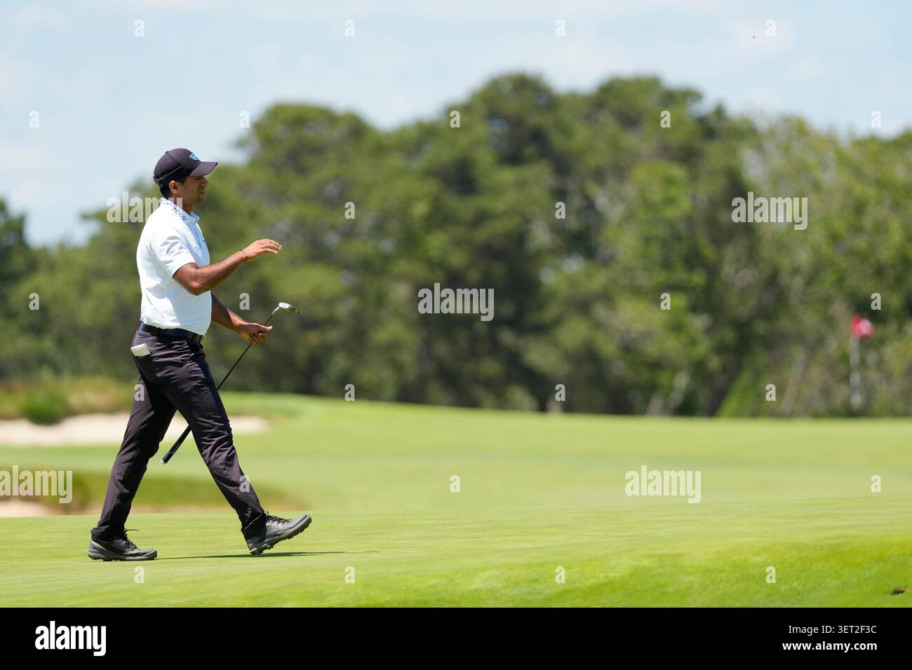 Aaron Rai, of England, celebrates after a birdie on the first hole ...