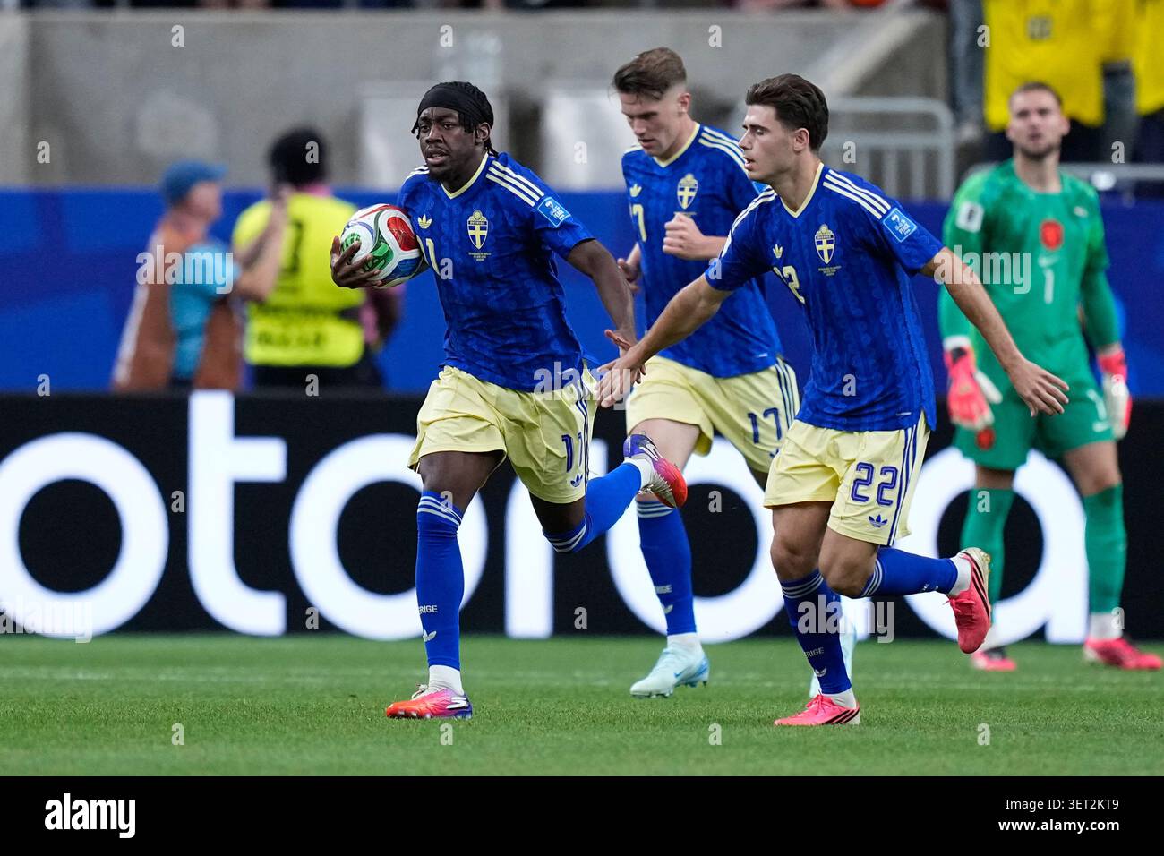 Sweden's Anthony Elanga, left, retrieves the ball after scoring his ...