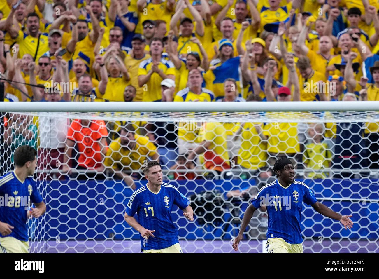 Sweden's Anthony Elanga, right, reacts after scoring his side's first ...