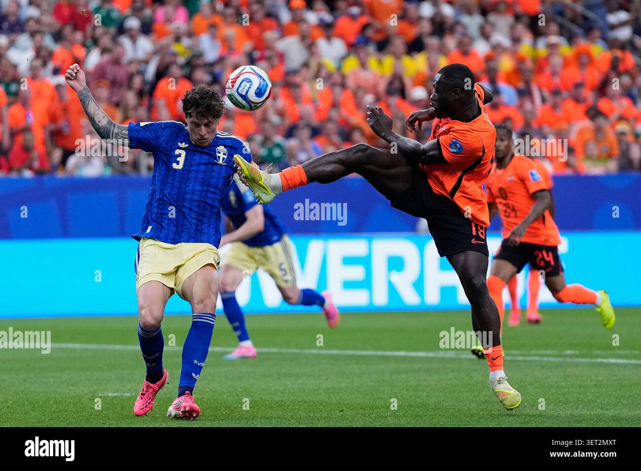 Netherlands' Brian Brobbey vies for the ball with Sweden's Victor ...