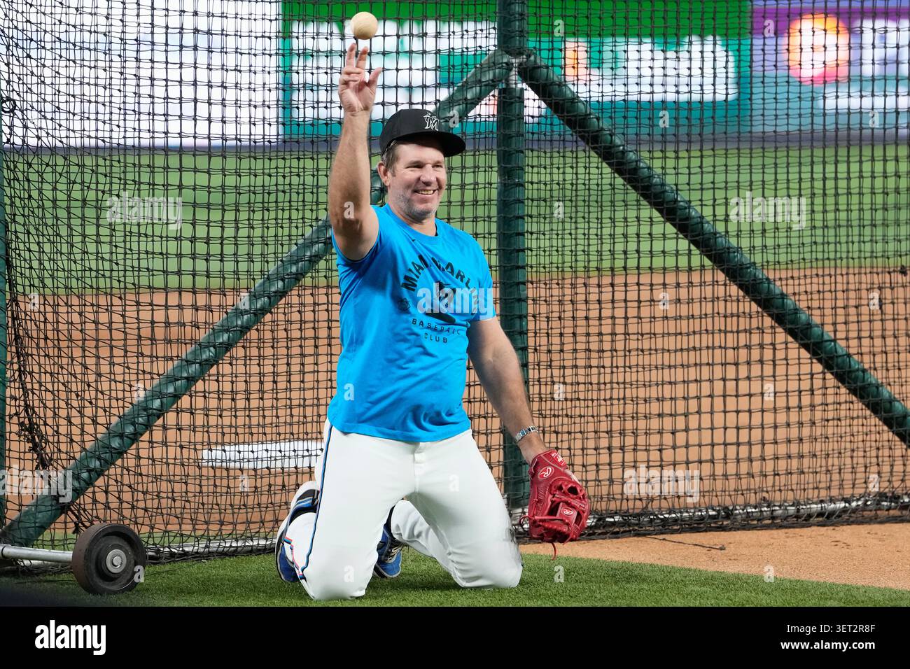 Miami Marlins manager Clayton McCullough throws a ball during batting ...