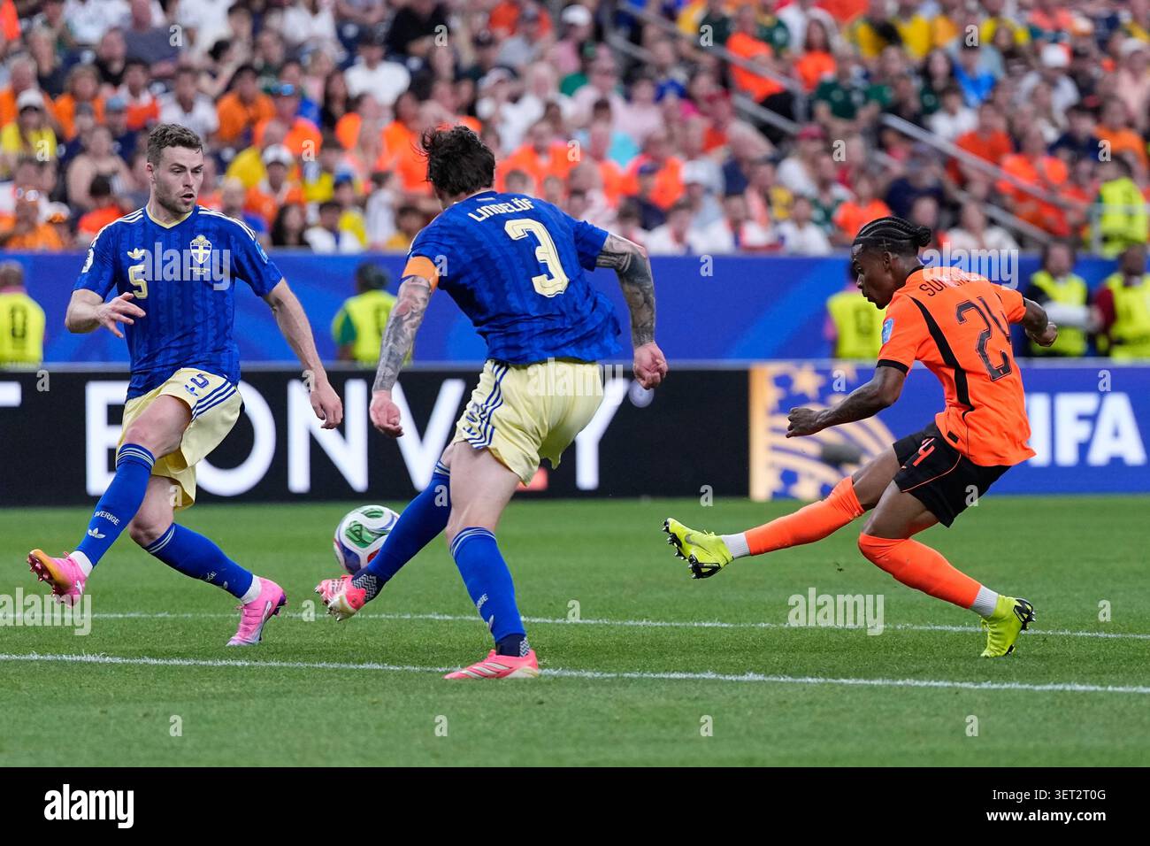 Netherlands' Crysencio Summerville, right, scores his side's fifth goal ...