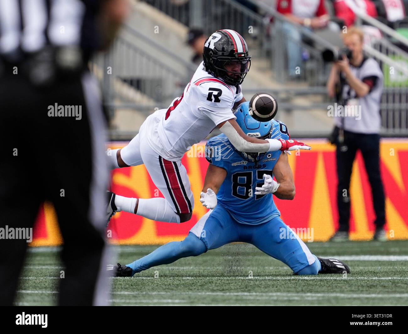 Ottawa Redblacks‚Äô Shakur Brown (9) leaps over Toronto Argonauts‚Äô ...
