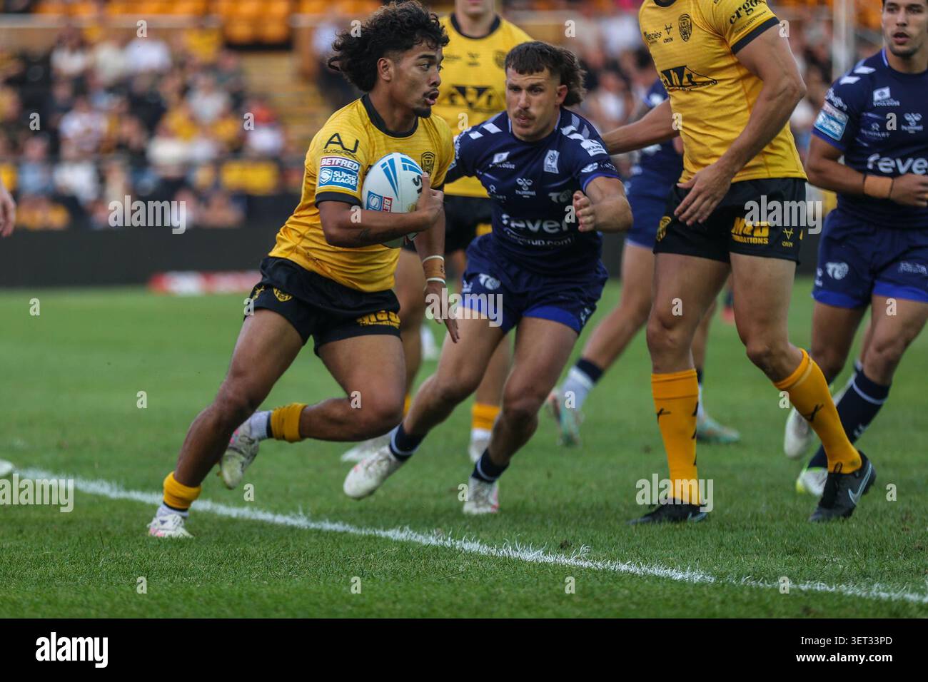 Phoenix Laulu-Togaga’e runs at the Toulouse defence during the BetFred ...