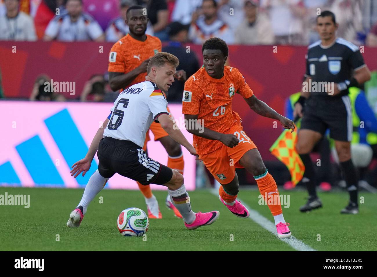 Germany's Joshua Kimmich, left, vies for the ball with Ivory Coast's ...