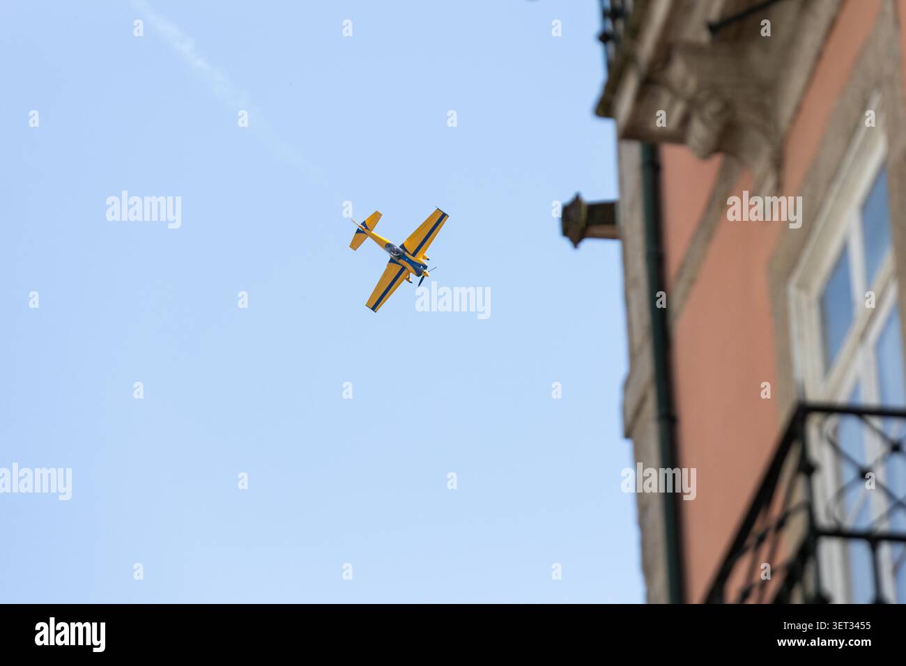 Porto, Portugal, 20 June 2026. A yellow and blue aerobatic aircraft ...