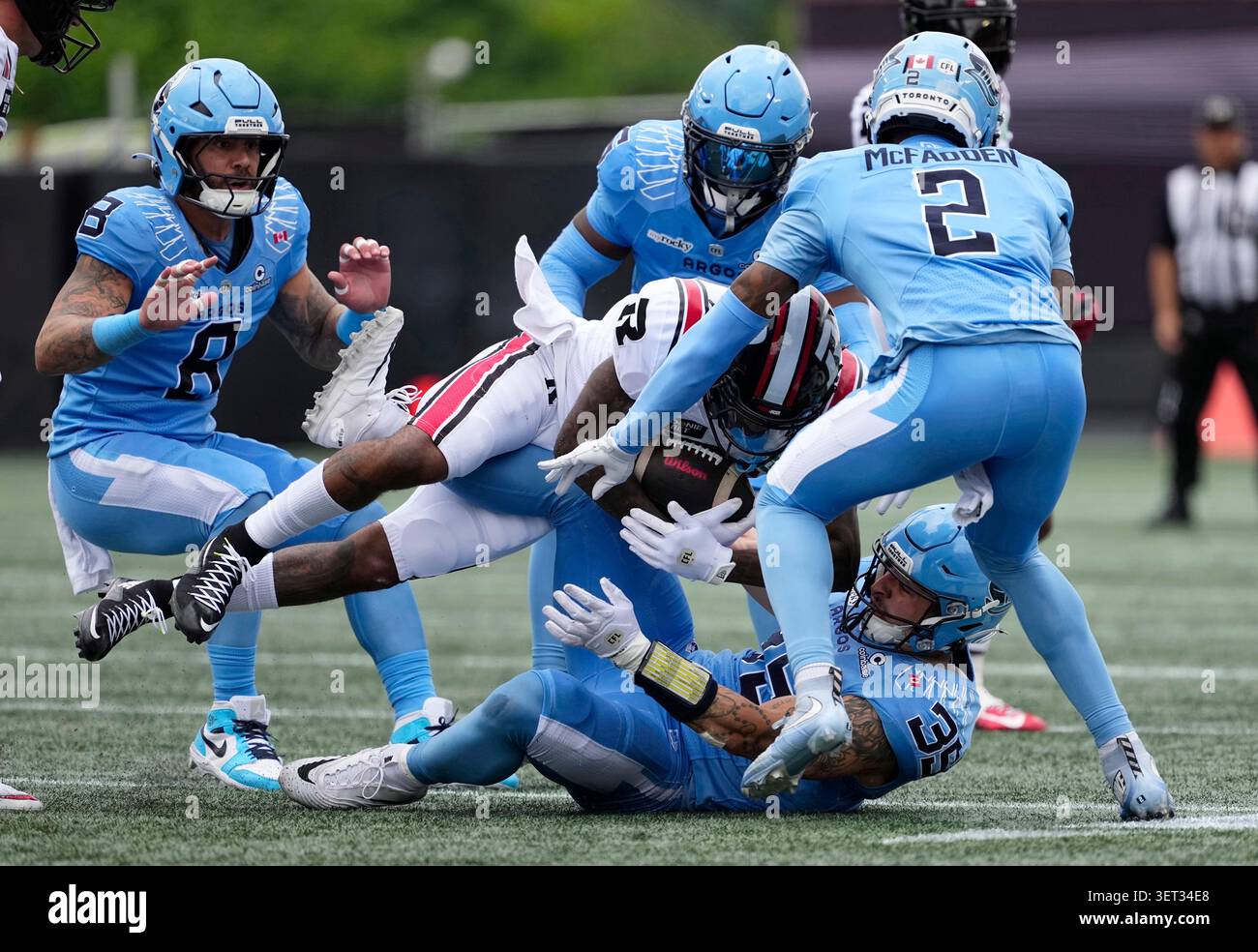 Ottawa Redblacks’ Greg Bell (5) gets tackled by Toronto Argonauts ...