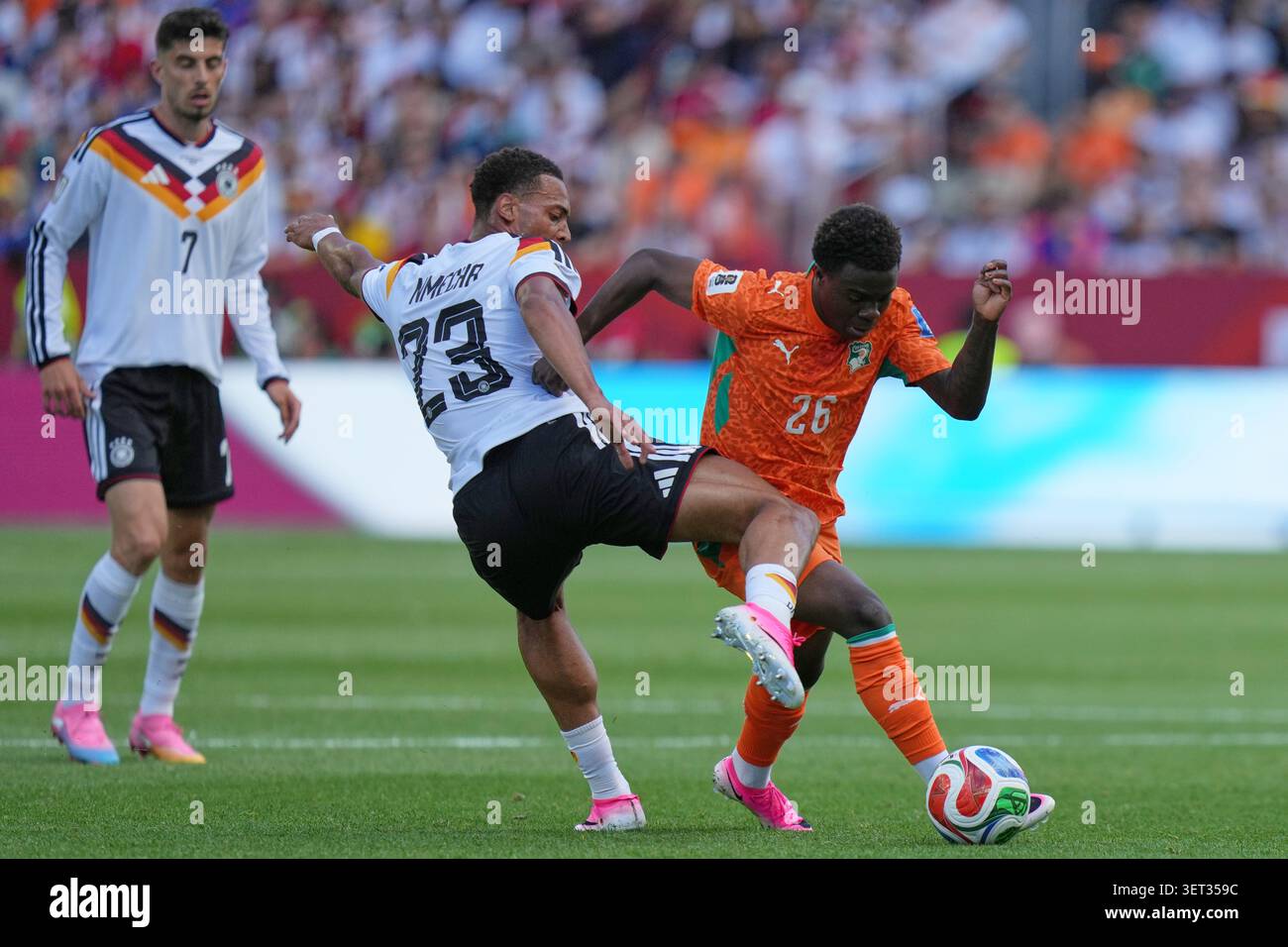 Germany's Felix Nmecha left, challenges Ivory Coast's Christ Inao Oulai ...