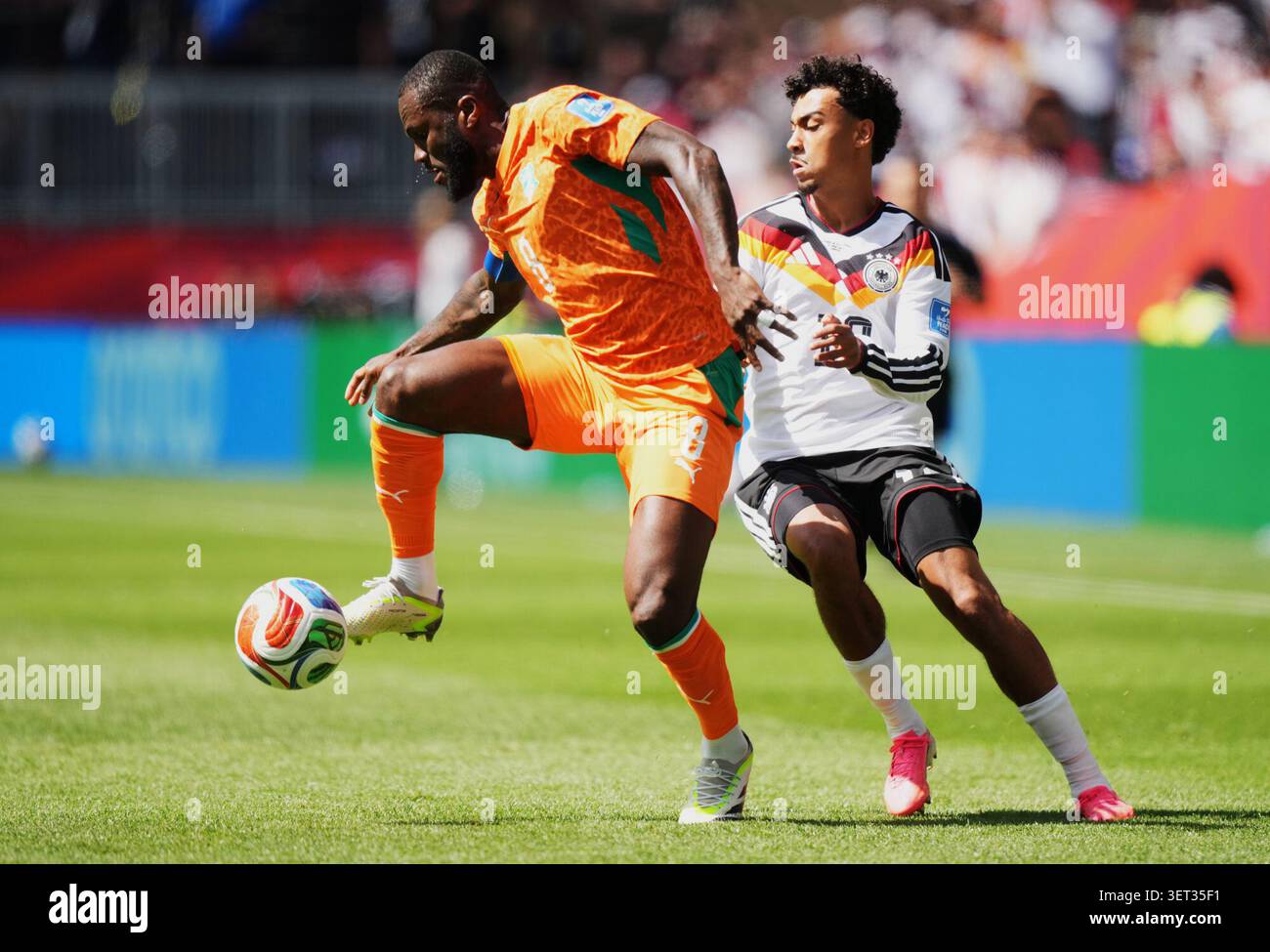 Ivory Coast's Franck Kessie (8) controls the ball in front of Germany's ...