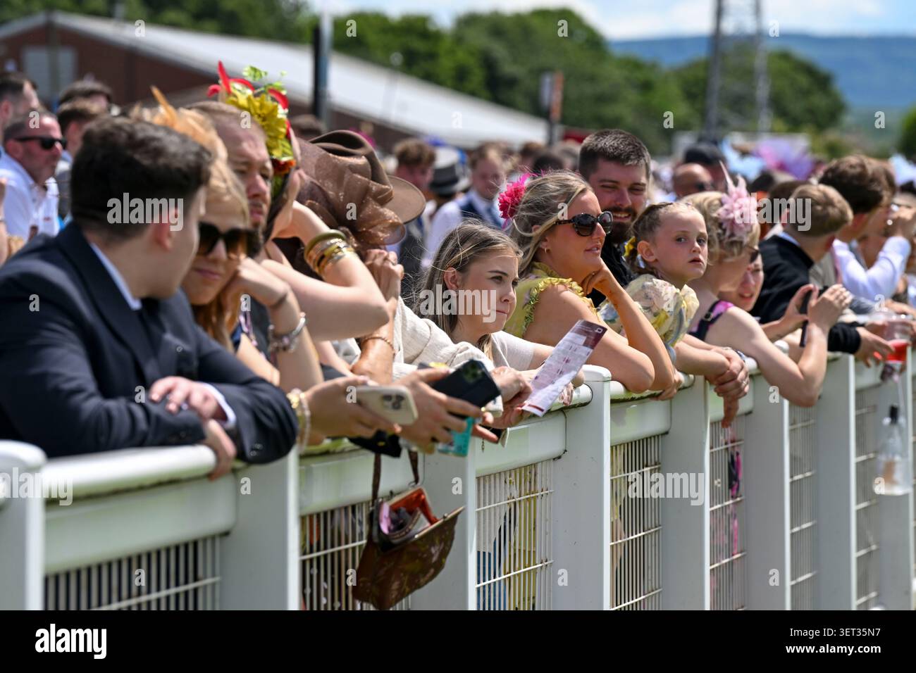 Punters gather for the first race during the Ladies' Day Meeting at ...