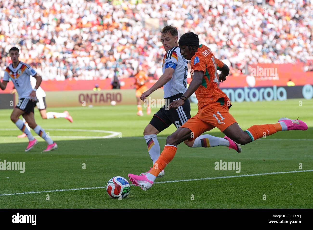 Ivory Coast's Yan Diomande, right, takes a shott at goal during the ...