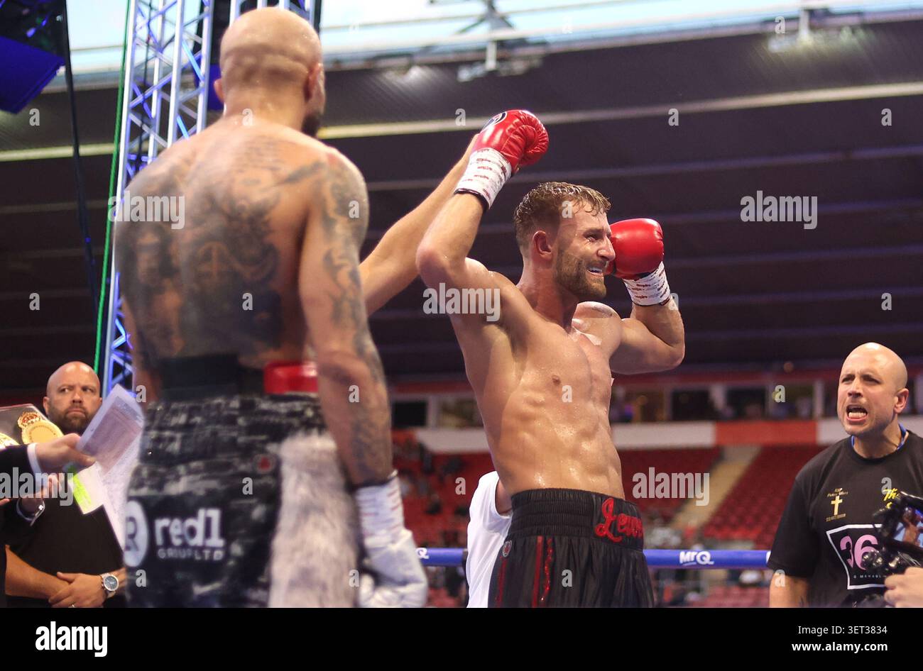 Lewis Edmondson (right) celebrates victory in the middleweight bout ...