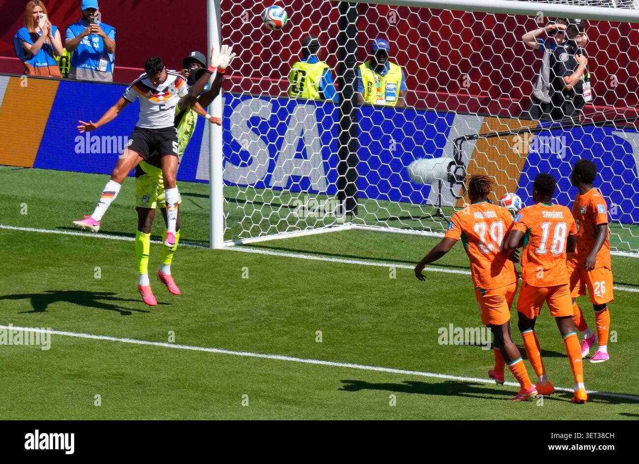 Germany's Aleksandar Pavlovic, right, fouls Ivory Coast goalkeeper ...