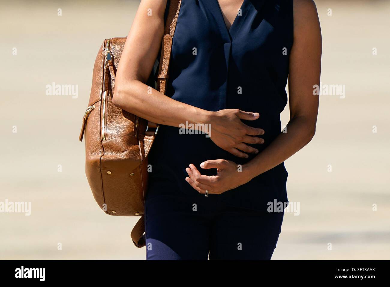 Second lady Usha Vance touches her abdomen after disembarking Marine ...